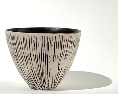Porcelain tea cup with striped decoration on a beige back... - 85153862 ...