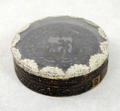 A circular fly box in brown boiled cardboard with a domed... - 77975901 ...